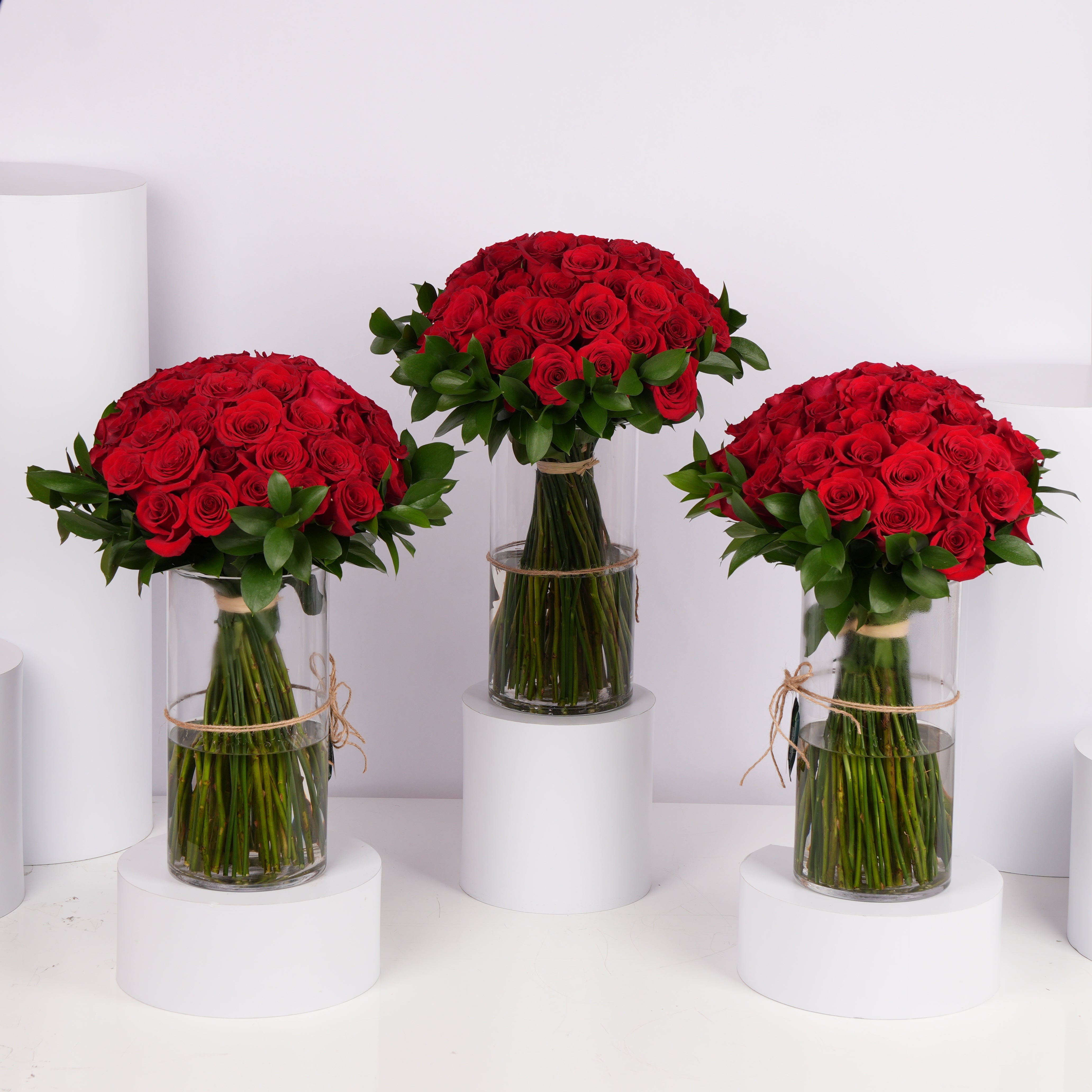 Buy Elegant Arrangement of 120 Red Roses in Glass Vases Online in Qatar ...